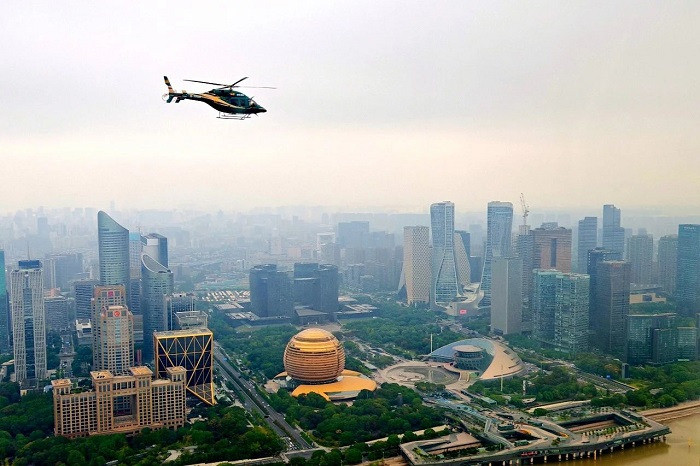 First low-altitude helicopter tour over Hangzhou's Qiantang River takes ...